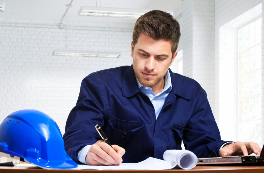 Portrait of an engineer working in his studio | eCompliance